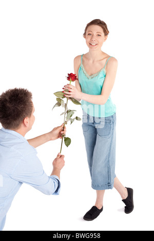 young man handing a red rose to his love Stock Photo - Alamy