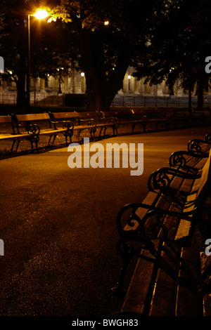 Night city park. Wooden benches, street lights and park alley Stock ...