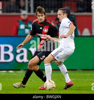 Manuel Friedrich (R) of Bayer 04 Leverkusen vies for the ball with ...