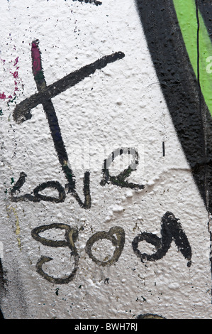 Graffiti on a wall "God is Love Stock Photo - Alamy
