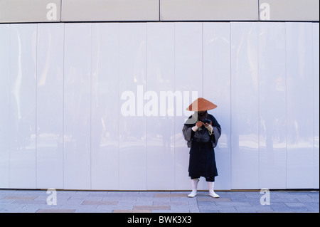 Japan Honshu Tokyo Ginza shinto monk in traditional dress walking on ...