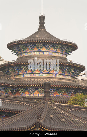The exterior of a building with a tiled roof and ornate windows ...