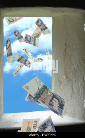 money flying out the window Stock Photo - Alamy