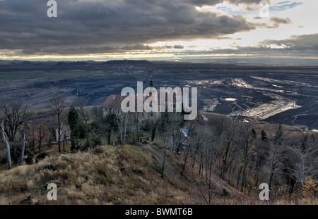 Coal opencast mine with old castle in the foreground Stock Photo - Alamy