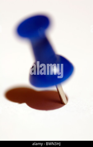Blue pin stuck in paper close up Stock Photo - Alamy