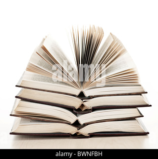 Stack of open old fanned hardcover leather bound books Stock Photo - Alamy