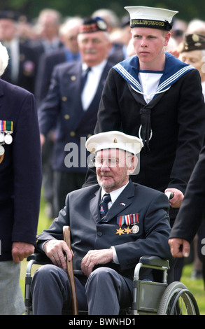 A disabled war veteran in a wheelchair wearing his campaign war medals ...