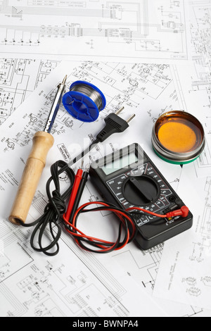 Electronics components on background of schematic circuit diagram ...