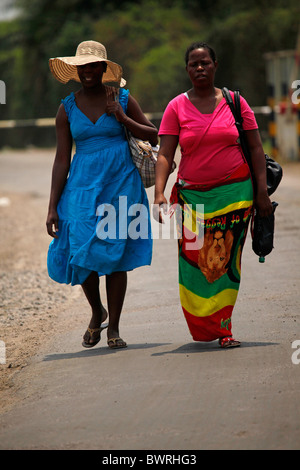 Victoria Falls Zambia; Two women tourists looking over the edge at the ...