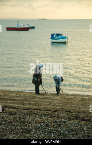 A woman Metal detecting on the beach at Instow. North Devon. UK Stock ...