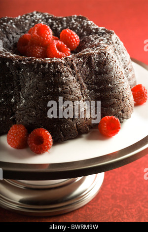 Chocolate Fudge Cake with Raspberry Coulis Stock Photo - Alamy