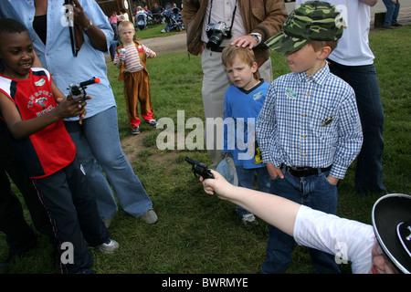 Various images of kids with toy guns Stock Photo - Alamy