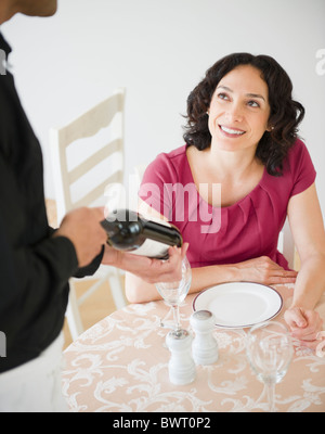 Hispanic man with curly hair asking for help smiling happy pointing ...