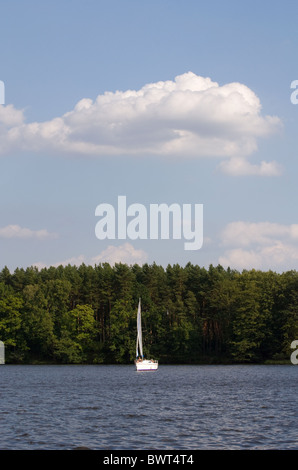 Afar boat sailing view at Nidzkie Lake Stock Photo - Alamy