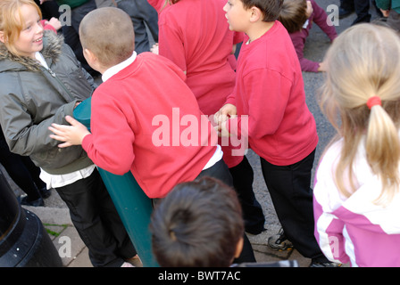 Children playing outside school in playground Stock Photo - Alamy