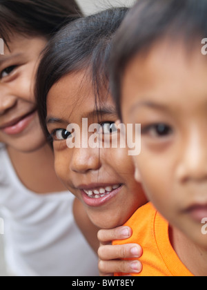 A group of cute, happy Filipino children pose for me in the Intramuros ...