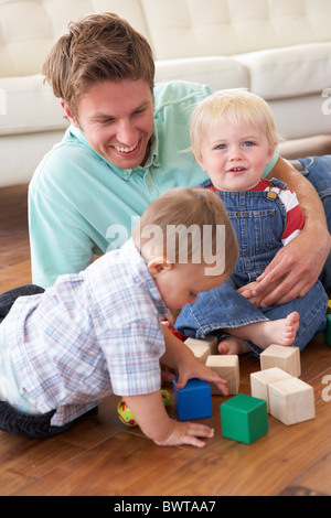 Child playing with wooden building blocks. Kid trial and error play ...