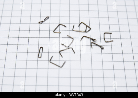 staples on cross-section sheet of paper Stock Photo - Alamy