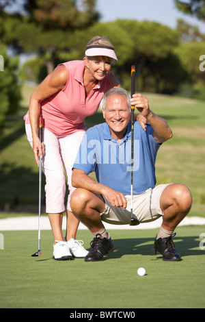 Senior Couple Golfing Stock Photo - Alamy