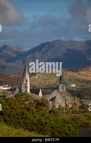 Church spires of the Connemara town of Clifden, in Ireland, with the ...