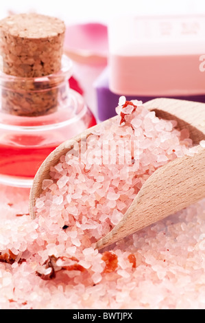 glass bath salt bottle, which has round shapes and is filled with blue ...