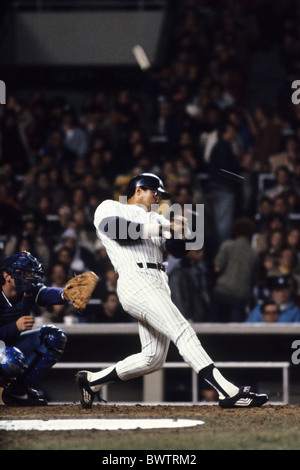 New York Yankees' Reggie Jackson, back to the camera, is greeted by ...