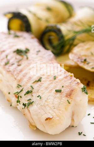 Coalfish fillet on zucchini, green asparagus and tomato, low carb Stock ...