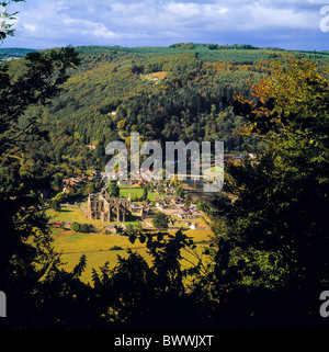 Aerial view of the ruins of Tintern Abbey surrounded by spectacular ...