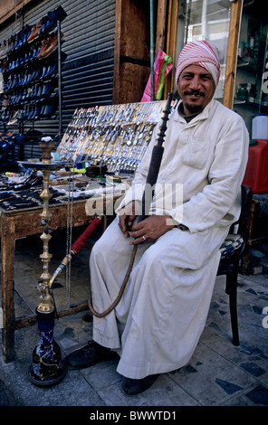 Man with a hookah pipe market stall Rome Italy Stock Photo - Alamy