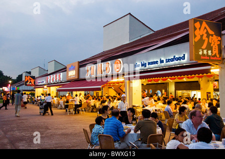Jumbo Seafood Restaurant with people dining at outdoor riverside tables ...