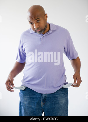 African american man holding empty wallet at street Stock Photo - Alamy