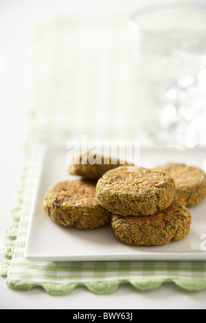 A closeup shot of a veggie burger without top bread isolated on white ...