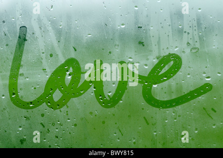 Foggy glass on window with written finger word free Stock Photo - Alamy