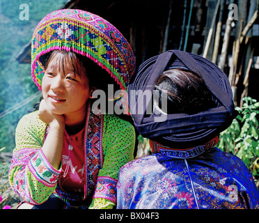 Red Hat Miao women in traditional costume embroidering, Longliang ...