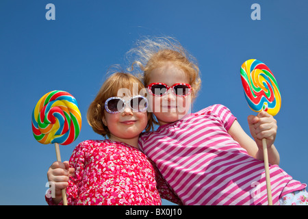 Girls with giant lollipop, London, UK Stock Photo - Alamy
