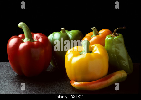Green organic Bell Peppers against a white background Stock Photo - Alamy