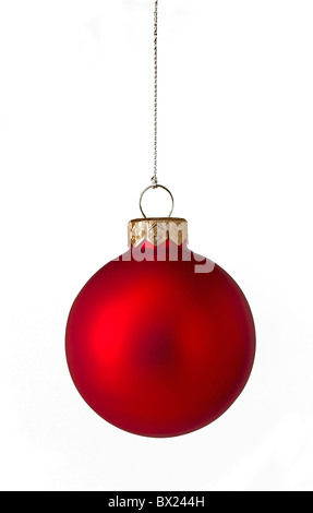 Single red Christmas bauble in front of a gold glitter background for ...