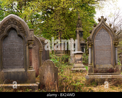 Graves and headstones of former residents in the Victorian cemetery in ...