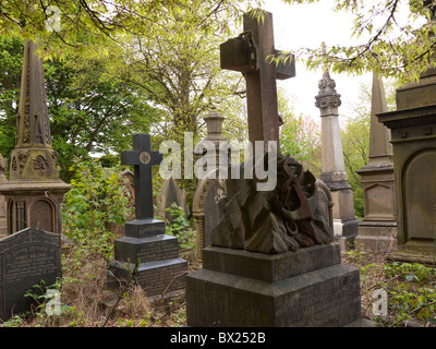 Graves and headstones of former residents in the Victorian cemetery in ...