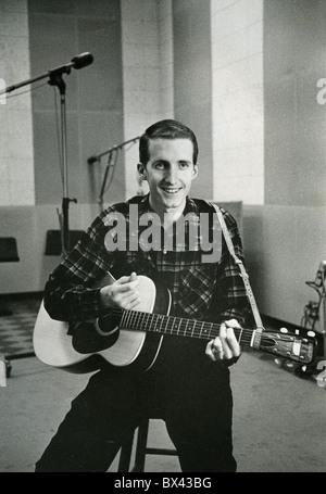Country and Western singer George Hamilton IV performs in front of ...