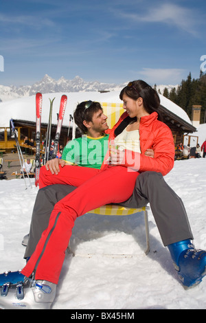 winter couple relax sunbath tanning chair deck chair mountain ...