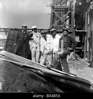 Czechoslovakia - Prague 1950. Construction workers mixing mortar during ...