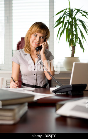 Beautiful young secretary on white background Stock Photo - Alamy