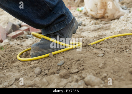 Site hazard tripping over an electric cable Stock Photo - Alamy