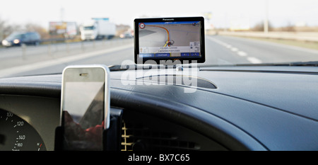 Panasonic Strada GPS navigation and iPhone in a car Stock Photo - Alamy