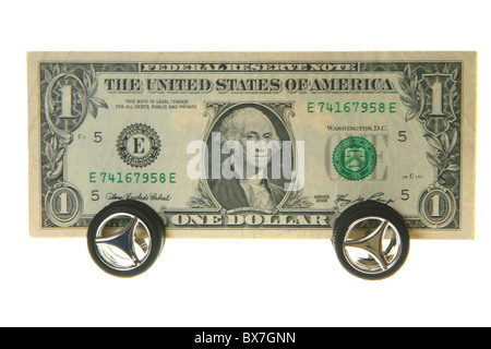 dollar bill on wheels Stock Photo - Alamy