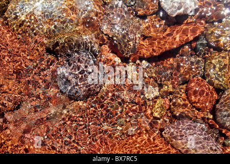 river water bottom stream red rocks transparency texture background ...