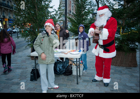 Paris, France, Christmas Celebrations, Children with Santa Claus ...