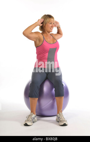 seated shoulder rotation on fit ball Stock Photo - Alamy