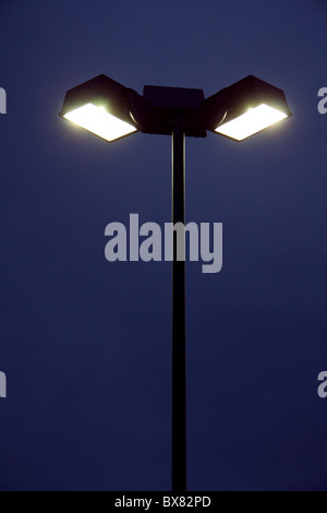 Illuminated halogen street light at night with dark background Stock ...